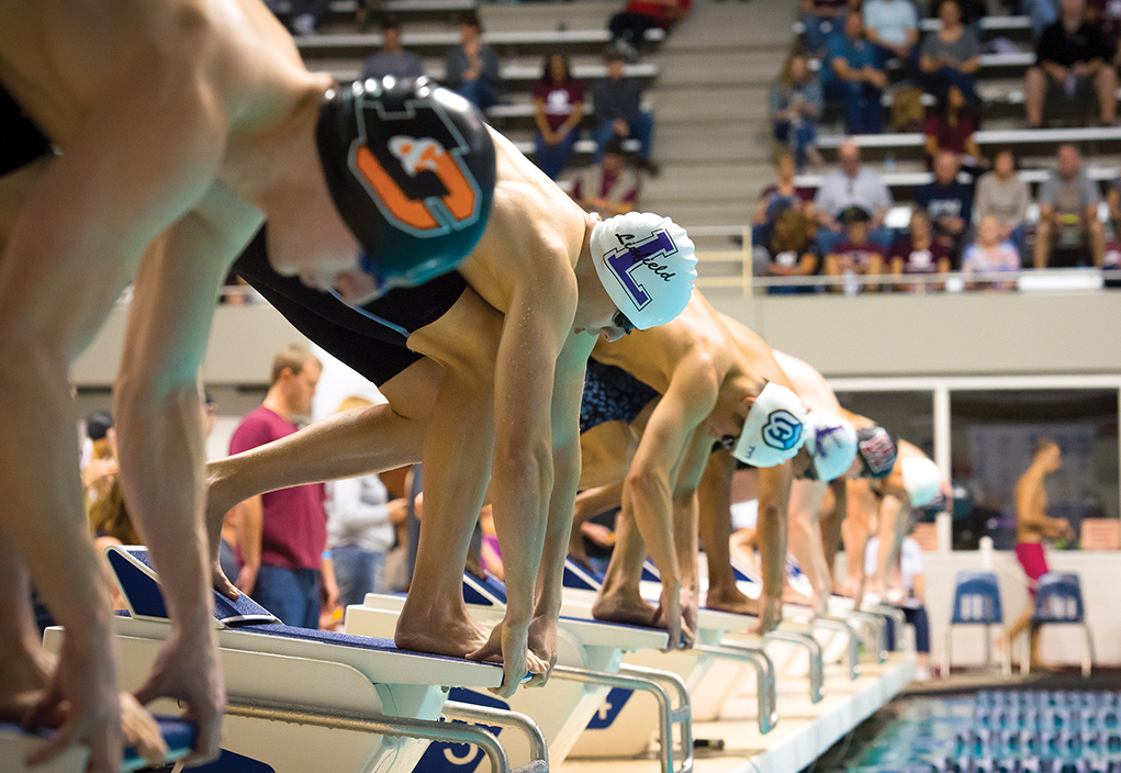 The swim team competes in the NWC Swim Championships. | Linfield Magazine